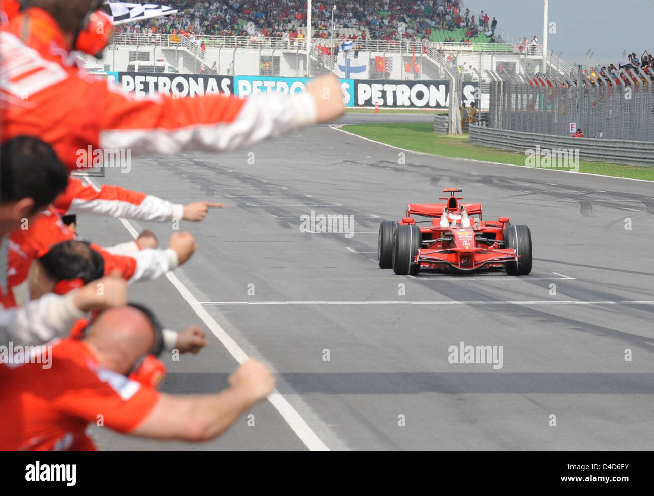 Finnish Formula One driver Kimi Raikkonen of Scuderia Ferrari crosses ...