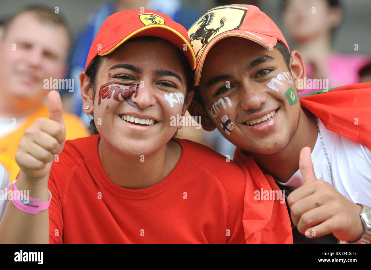 Two fans of Ferrari pose during the drivers' paradee before the 2008 ...