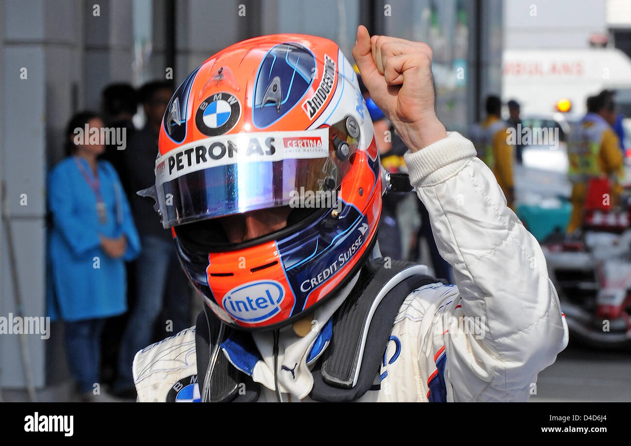 Polish Formula One driver Robert Kubica of BMW Sauber celebrates ...
