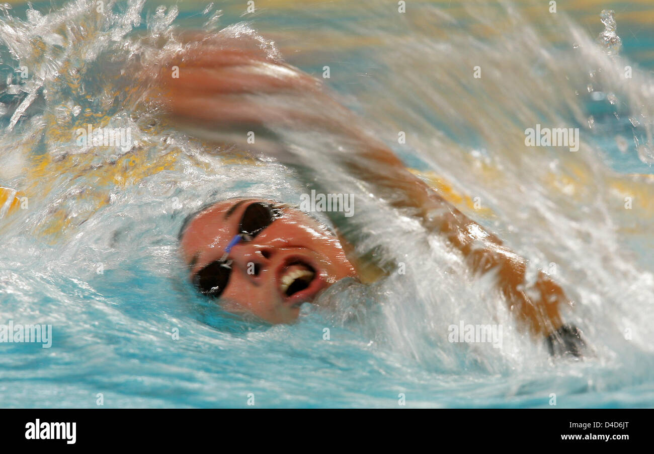 Flavia Rigamonti of Switzerland ploughs through the water to win the ...