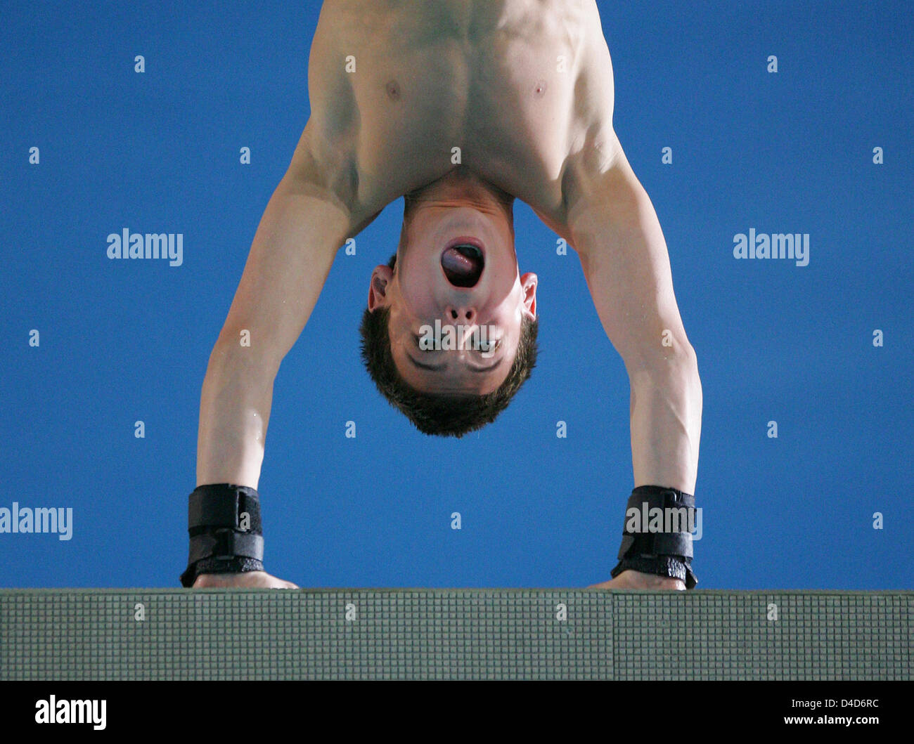 Thirteen-year old Thomas Daley of Great Britain makes a handstand on ...