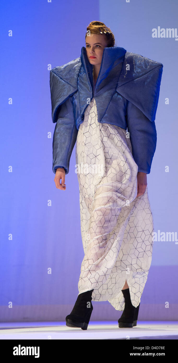 A female model presents the final year fashion design of a graduate ...