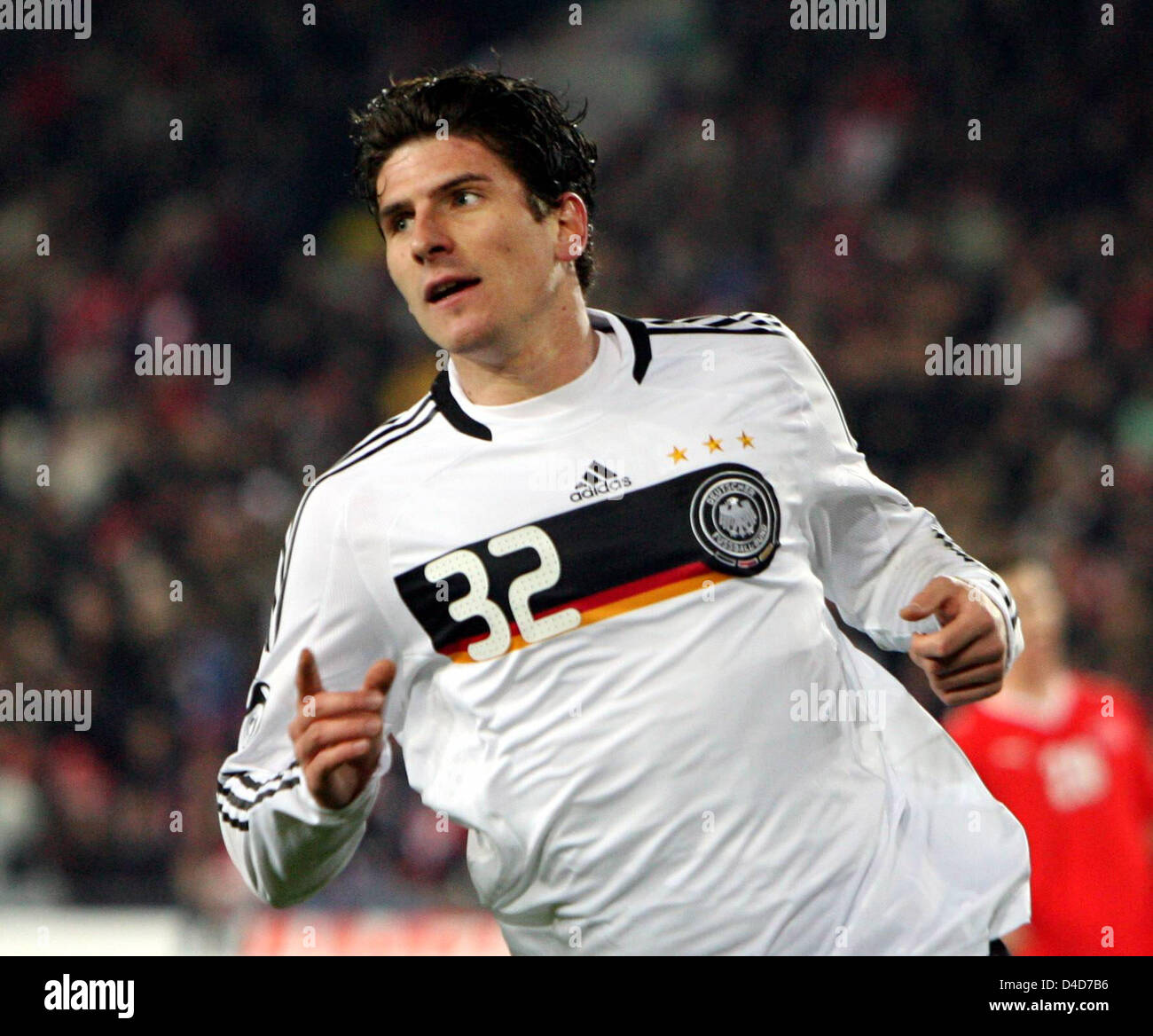 Germany's Mario Gomez celebrates scoring the 0-3 in the test cap ...