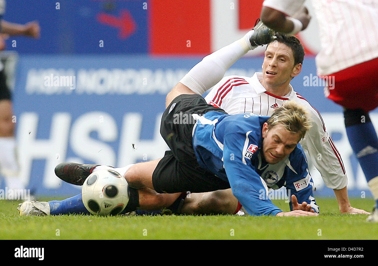 Hamburg's Bastian Reinhardt (back) vies for the ball with Bielefeld's ...