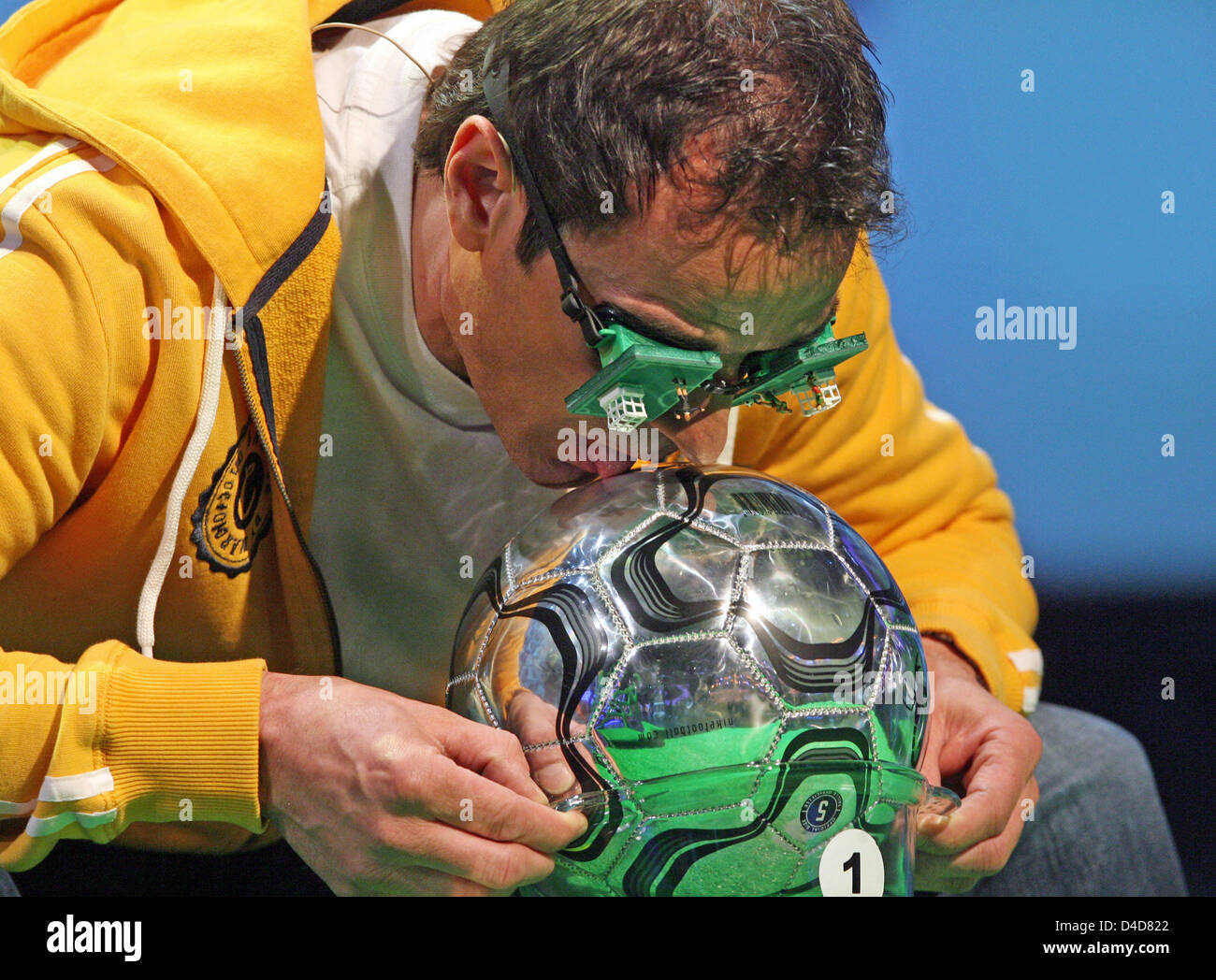 43-year old Alex Haas from Liechtenstein is pictured licking a ball ...