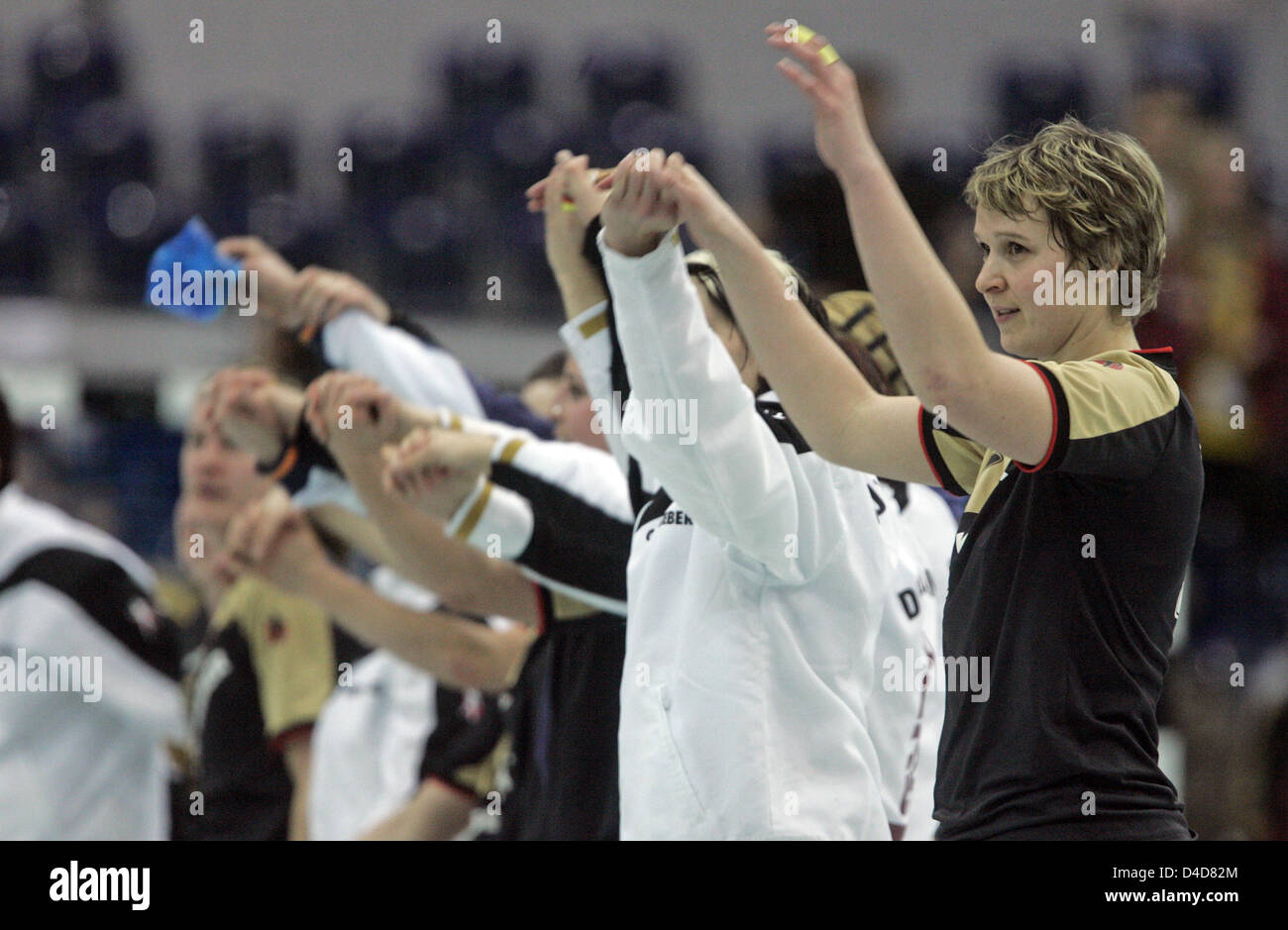 The German female handball team cheer after defeating Cuba in an ...