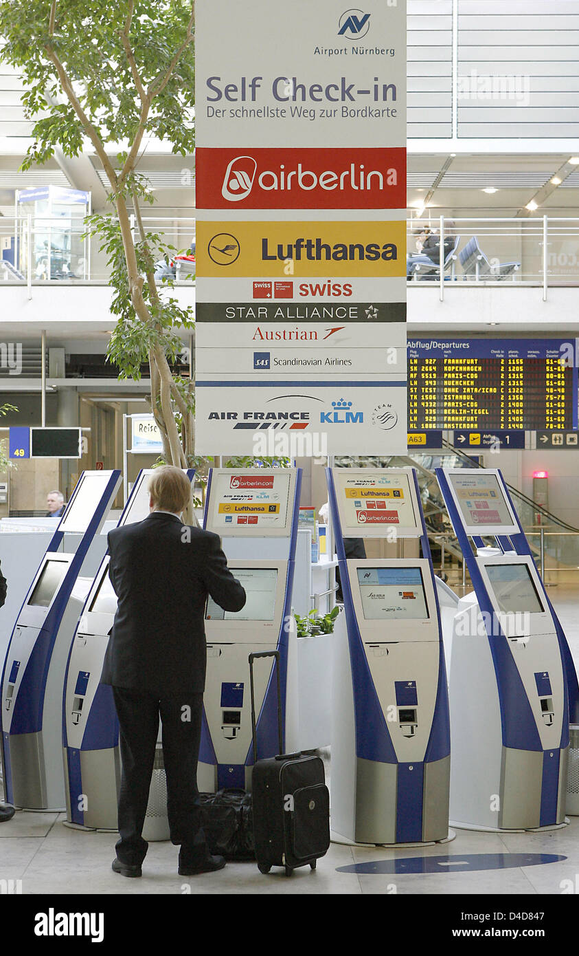The picture shows a passenger at the Self Check-in counter at the ...