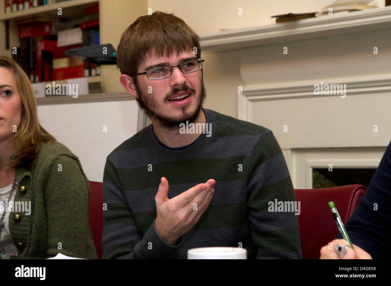 University students discussing literature in study Stock Photo - Alamy