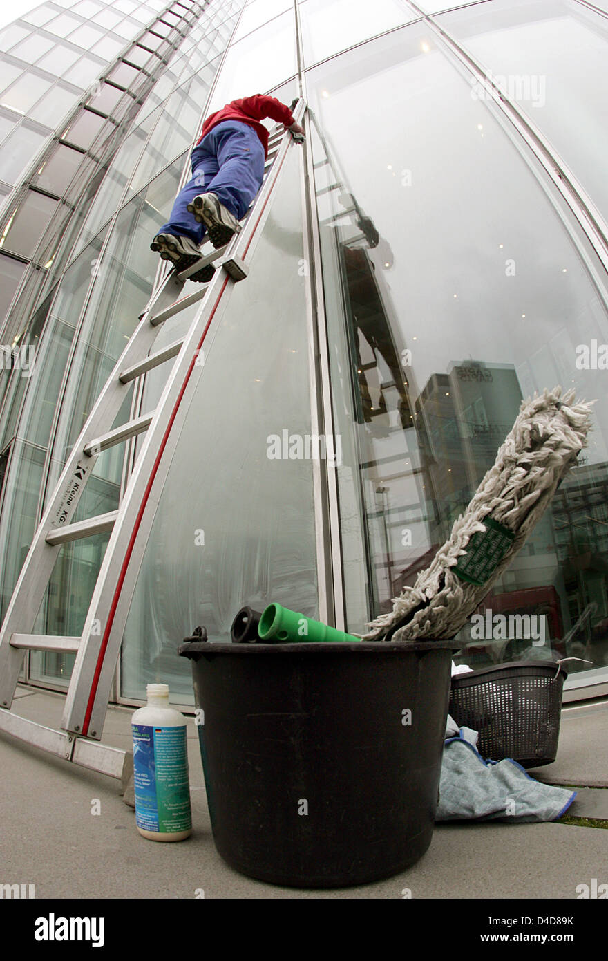 A window cleaner cleanses a tower block in Duisburg, Germany, 30 ...