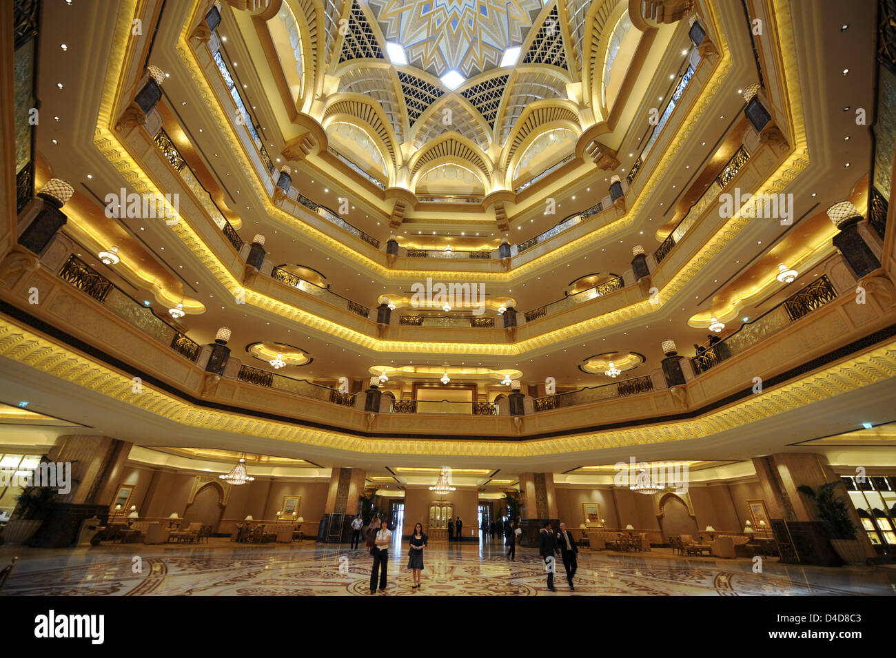 The photo depicts the luxurious interior of Emirates Palace Hotel in ...