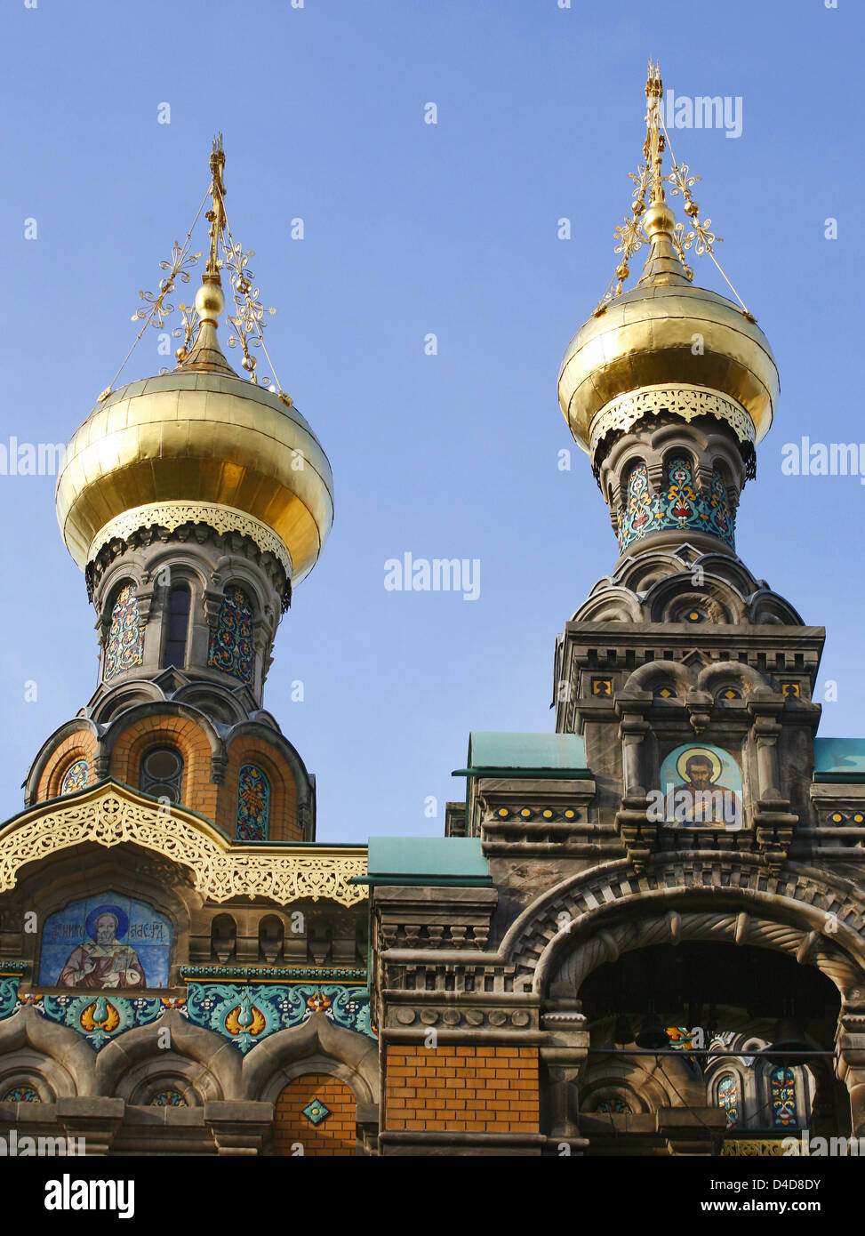 The photo depicts the two golden spires of the Russian Chapel in ...