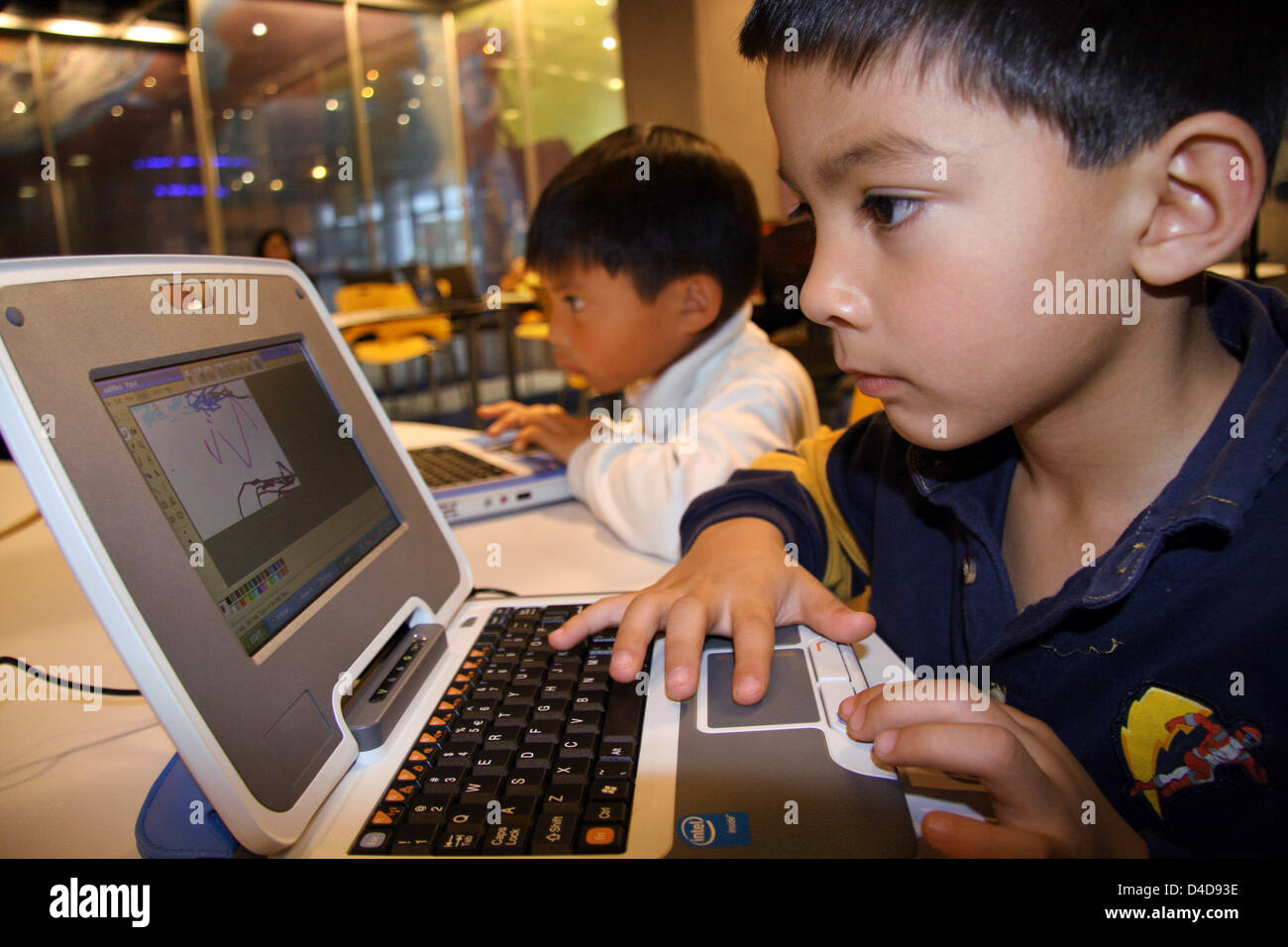 The undated handout by US computing company Intel shows pupils and ...