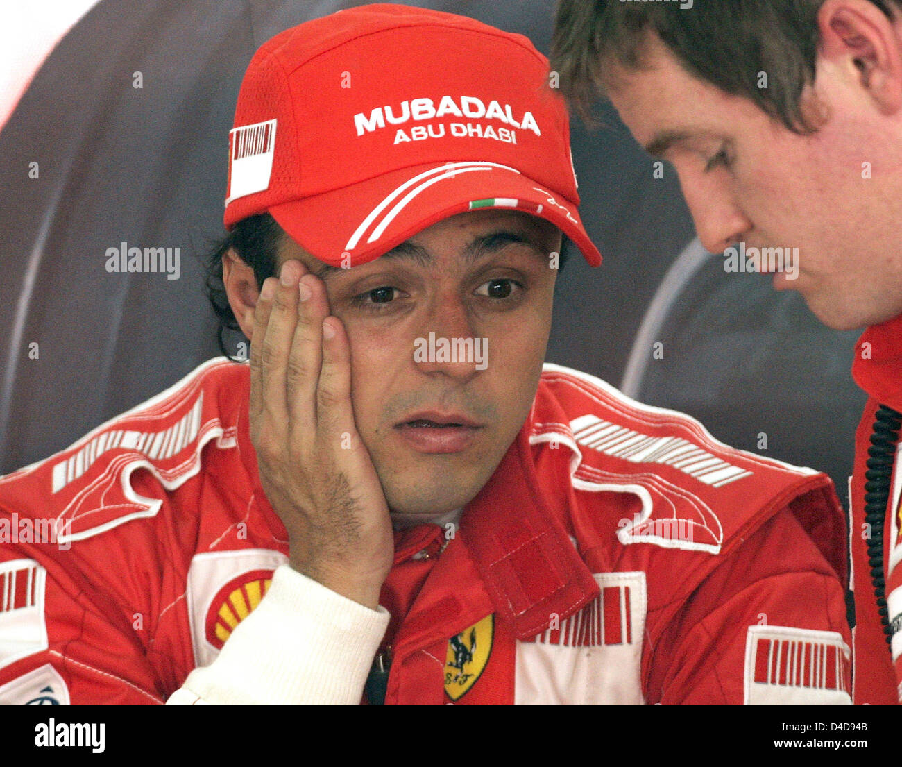 Brazilian Formula One driver Felipe Massa of Scuderia Ferrari confers ...
