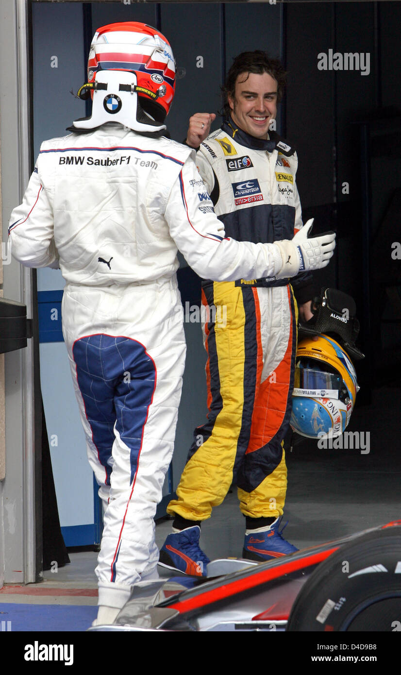 Polish Formula One driver Robert Kubica (L) of BMW Sauber celebrates ...