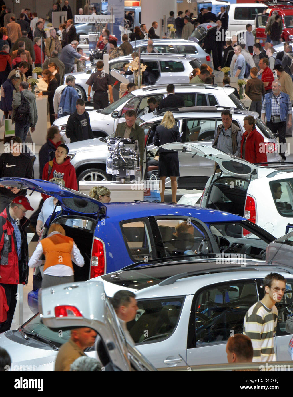 Visitors at the Auto Mobil International (AMI) motor show in Leipzig ...