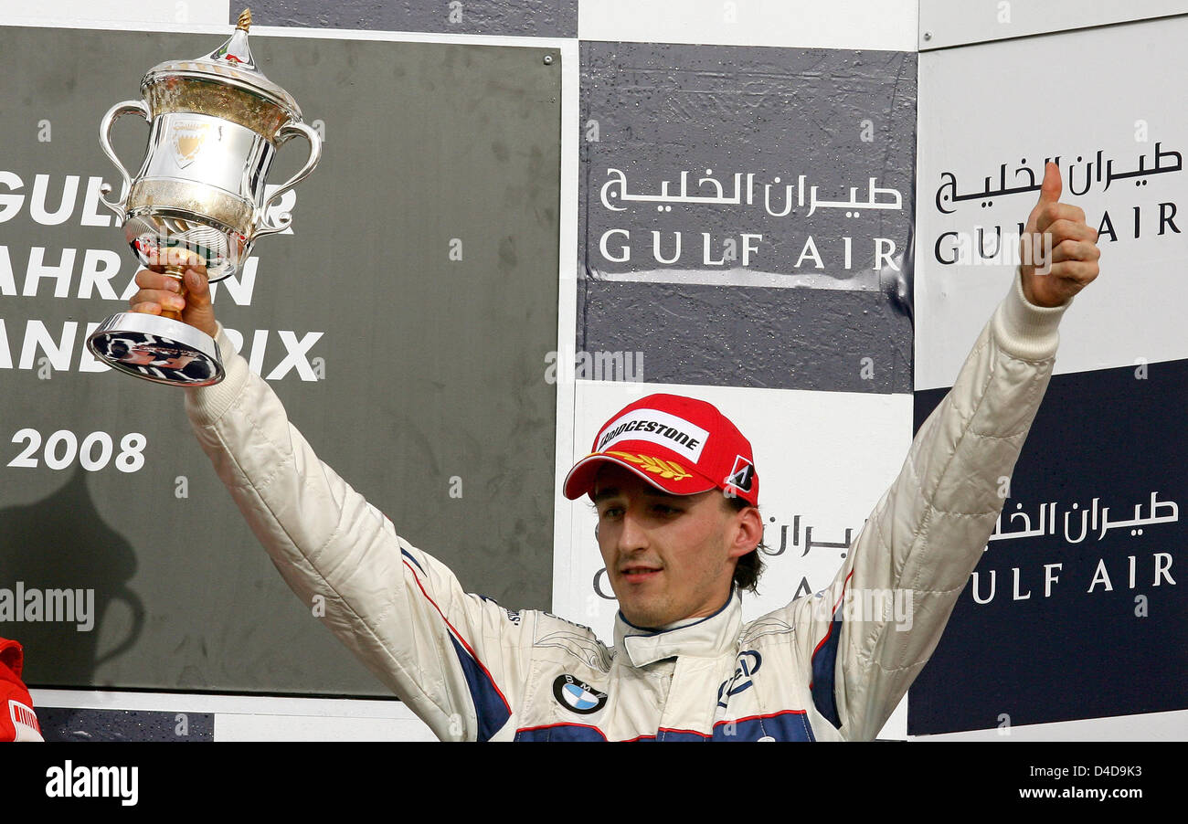 Polish Formula One driver Robert Kubica of BMW Sauber celebrates on the ...