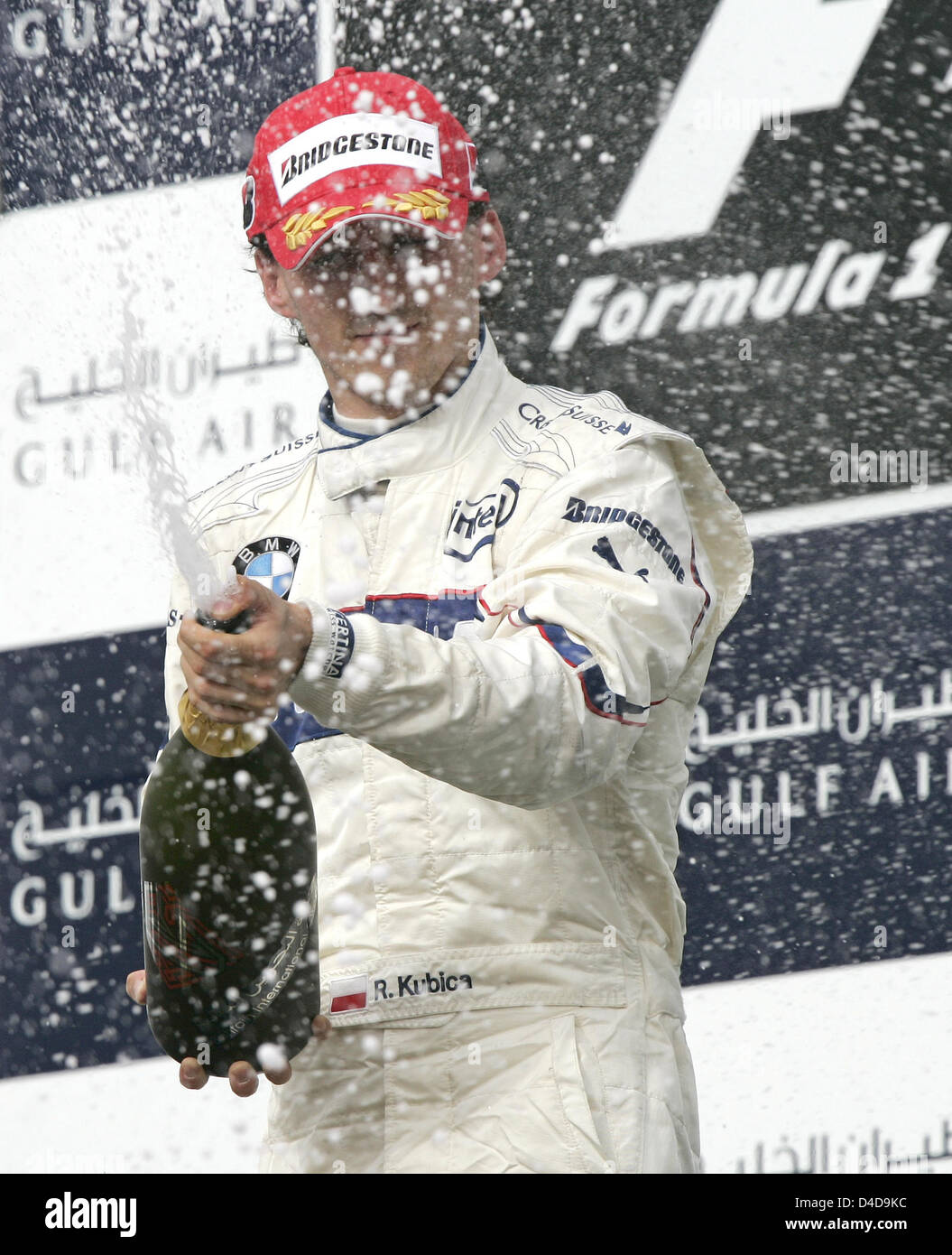 Polish Formula One driver Robert Kubica of BMW Sauber celebrates with ...