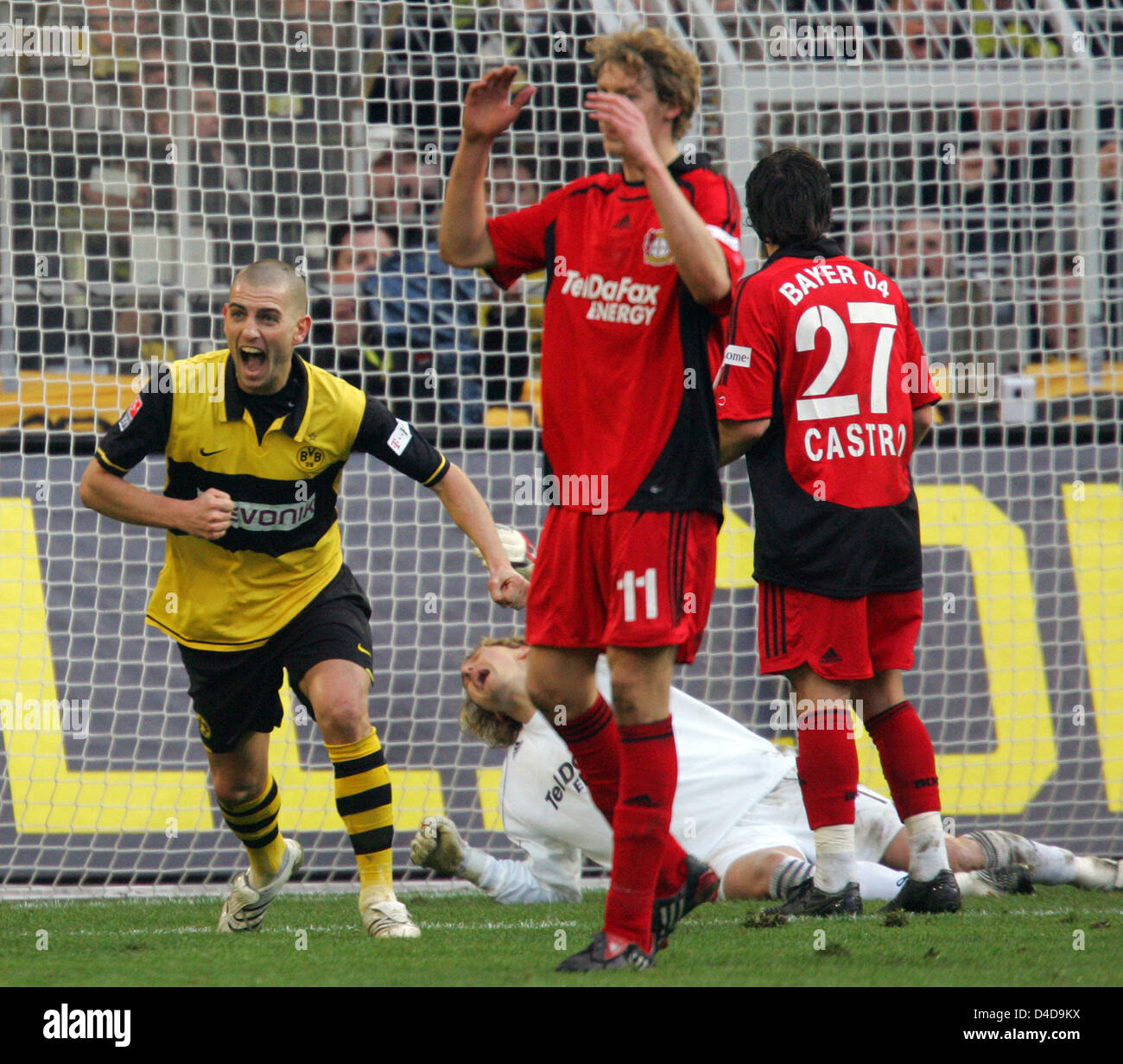Dortmund's Mladen Petric celebrates the 2-1 winner while Leverkusen's ...