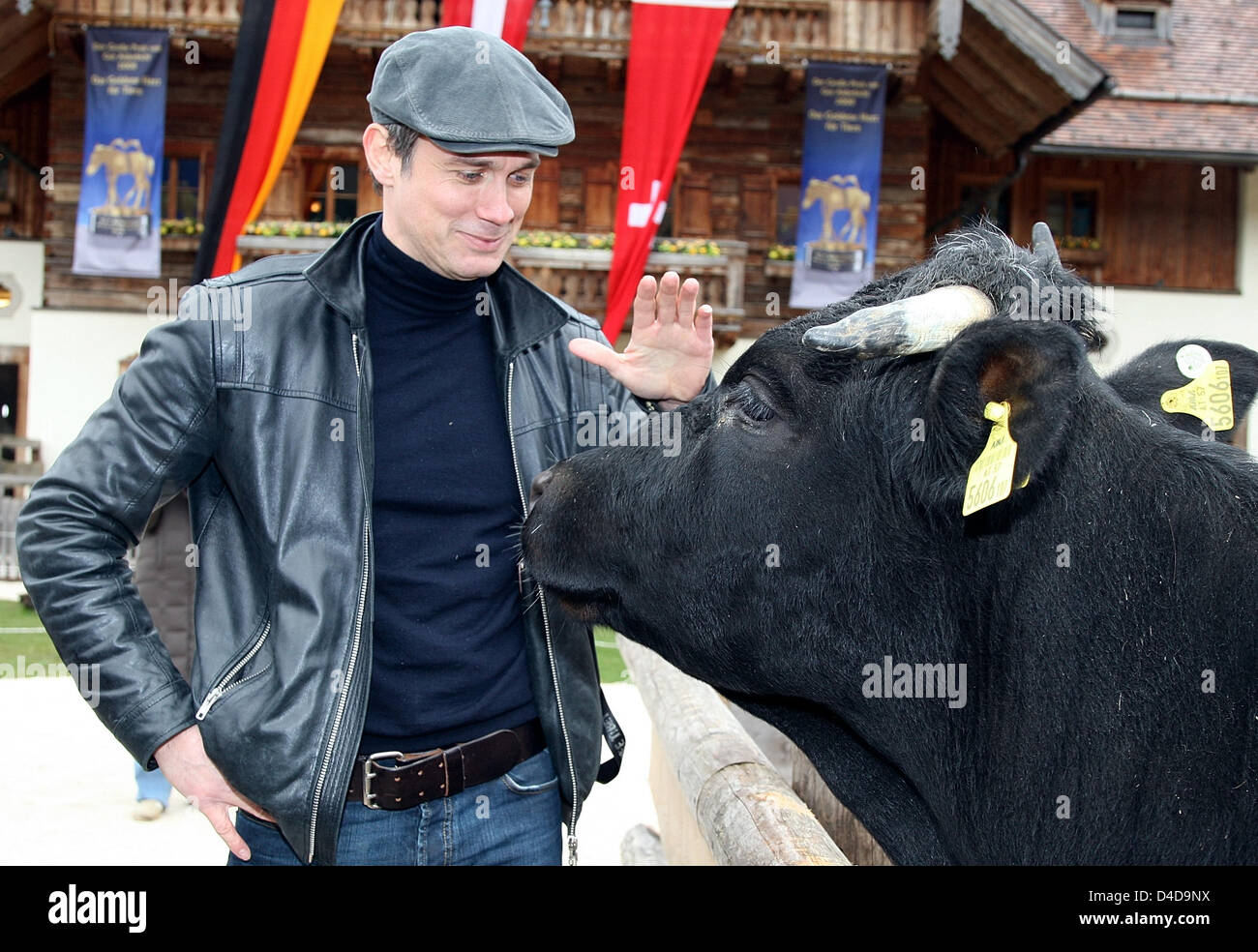 German actor Ralf Bauer poses with a bull at animal sanctuary Gut ...