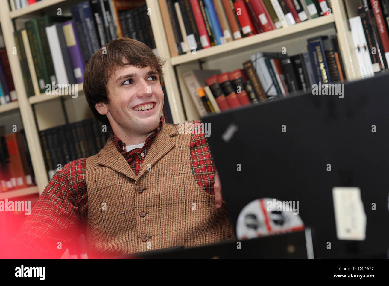 University students discussing literature in study Stock Photo - Alamy