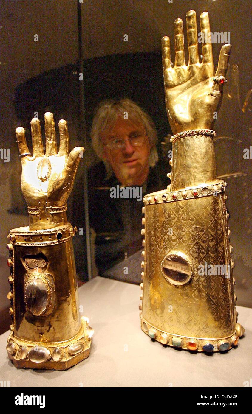 A man eyes relics forming part of the Halberstadt cathedral treasure on ...