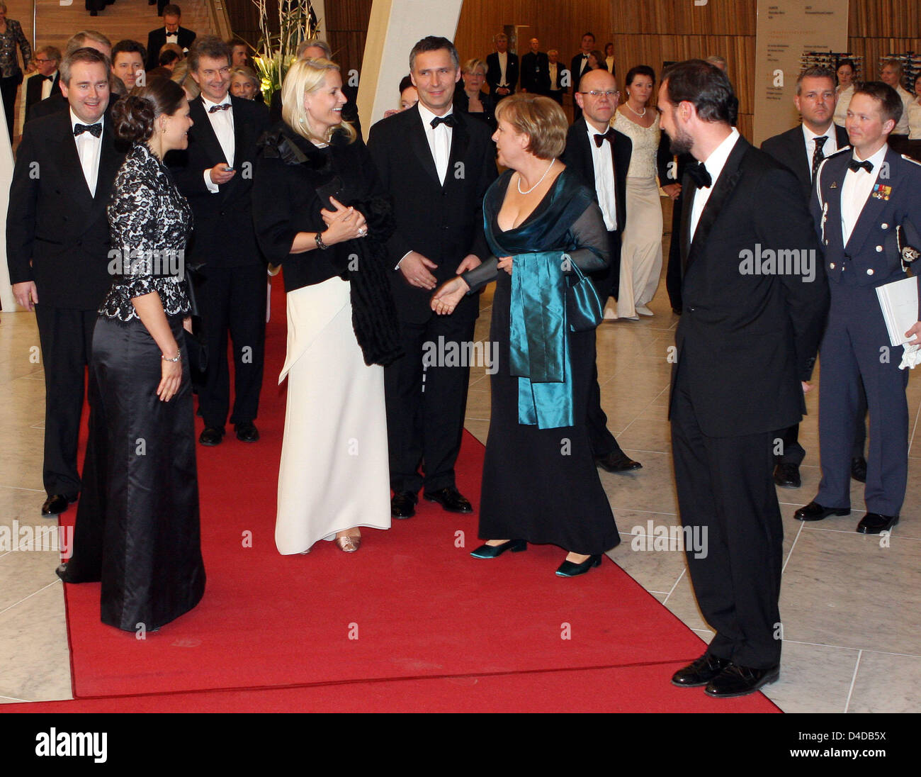 German Chancellor Angela Merkel (2-R) is welcomed by Swedish Crown ...