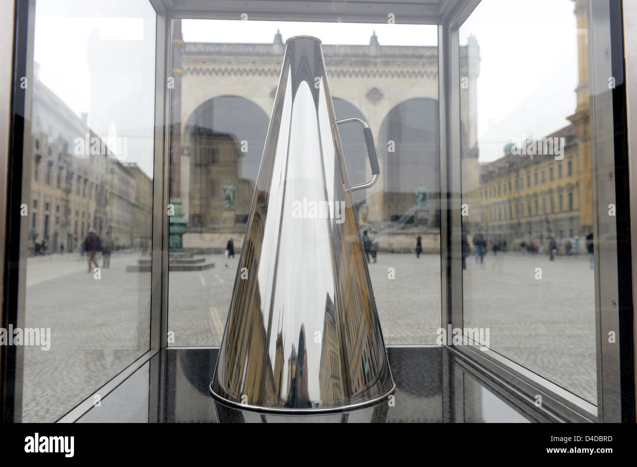 A megaphone sits in a glass case before the performance 'It's Never Too ...