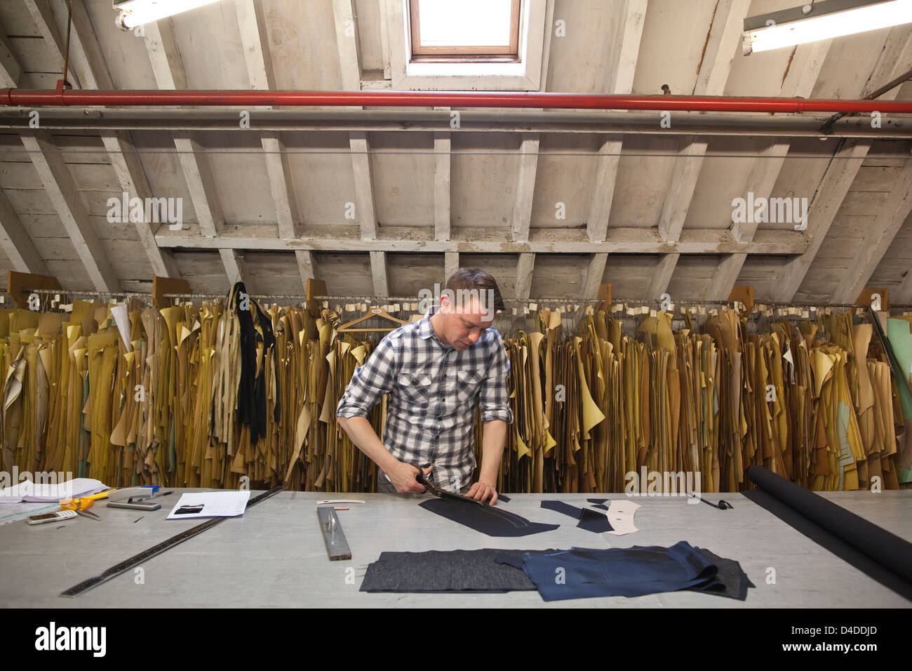 Pattern cutter Rob Turner at British clothes manufacturer Private White ...