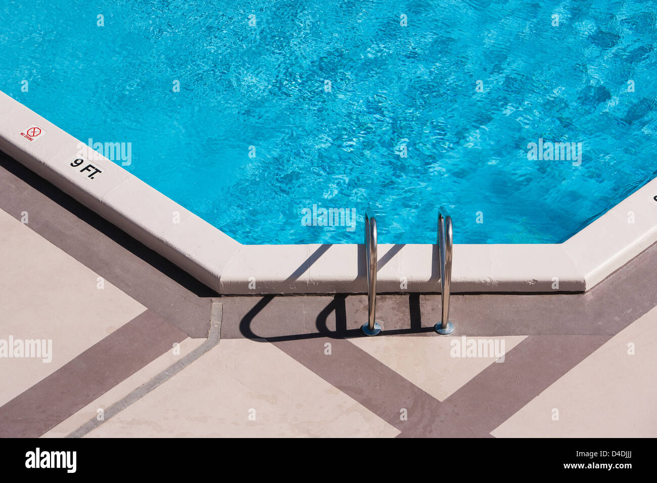 Swimming pool with ladder Stock Photo - Alamy