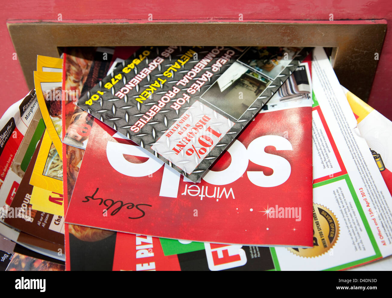 Junk mail and flyers in letterbox, London Stock Photo - Alamy