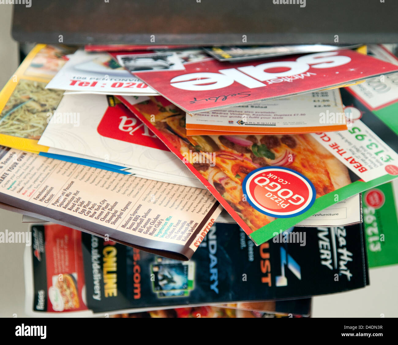 Junk mail and flyers in letterbox, London Stock Photo - Alamy