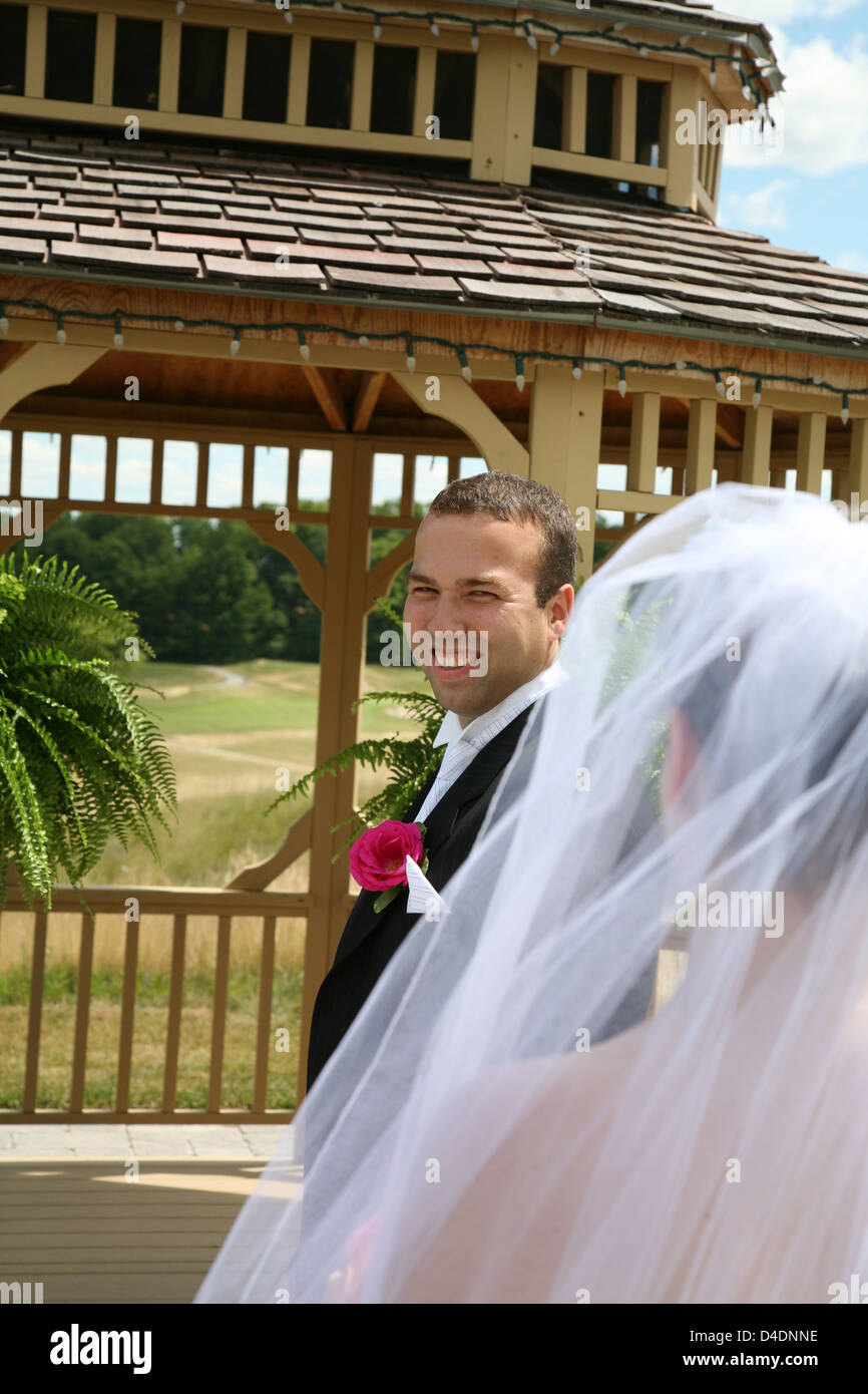 Groom looking at bride Stock Photo - Alamy