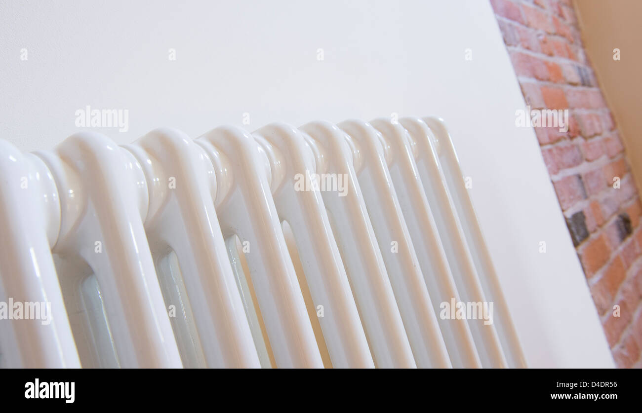 Wall mounted radiator in a newly converted barn in rural England Stock ...