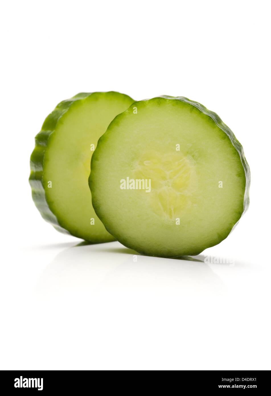 Two cucumber slices isolated on white background Stock Photo - Alamy