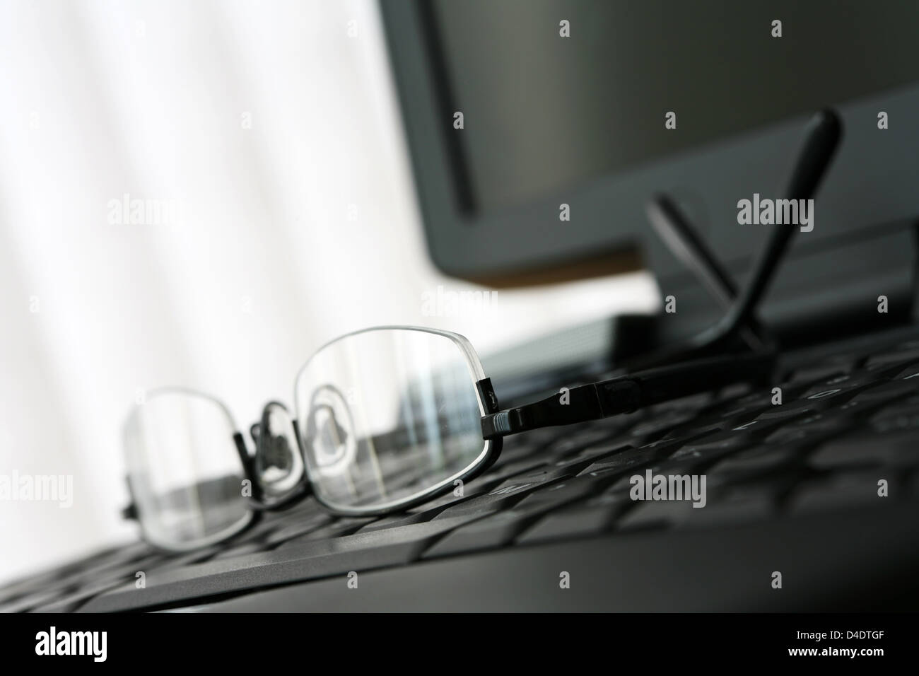 Glasses on Laptop Keyboard Stock Photo - Alamy