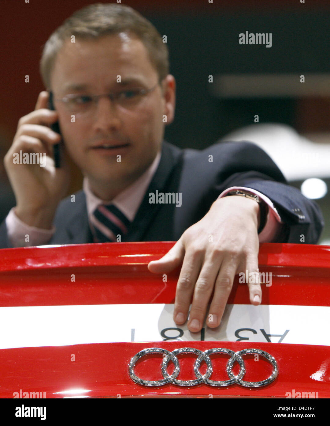 A man is pictured with an Audi at a showroom during the automobile ...