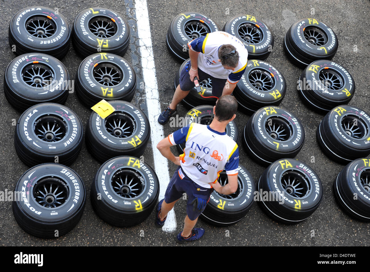 Mechanics of Renault F1 team prepare tyres at the circuit de Catalunya ...