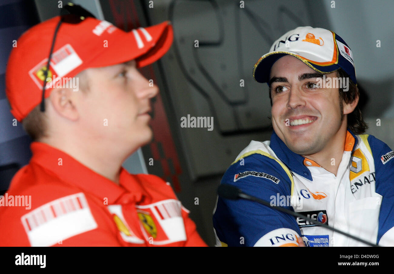 Finnish Formula One driver Kimi Raikkonen of Scuderia Ferrari (L) and ...