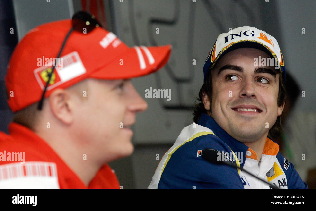 Finnish Formula One driver Kimi Raikkonen of Scuderia Ferrari (L) and ...