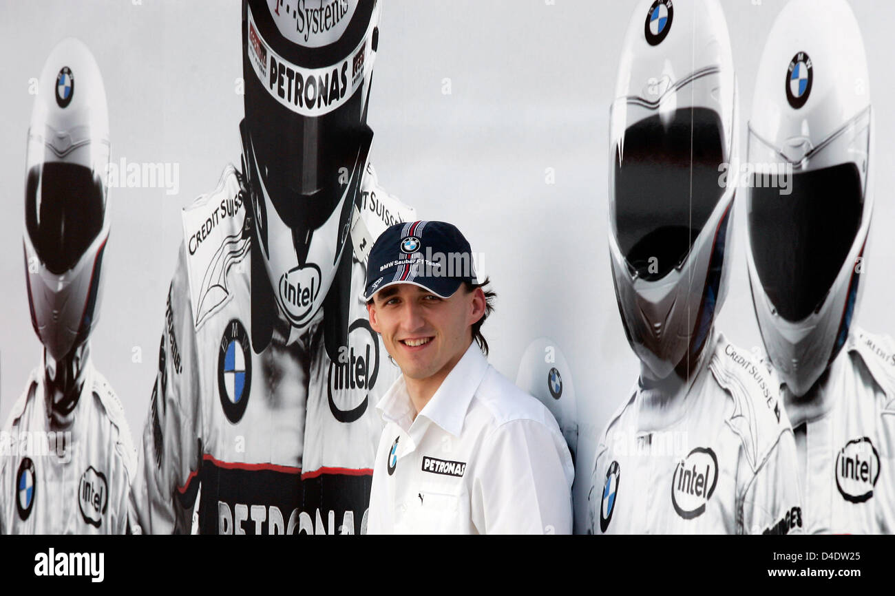 Polish Formula One driver Robert Kubica of BMW Sauber poses beside a ...