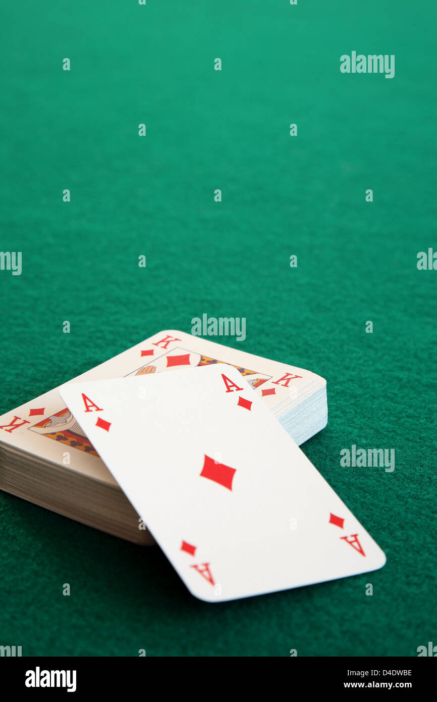 Ace of diamonds on a stack of playing cards Stock Photo - Alamy