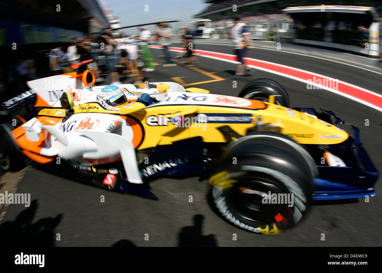 Spanish Formula One driver Fernando Alonso of Renault F1 leaves the pit ...