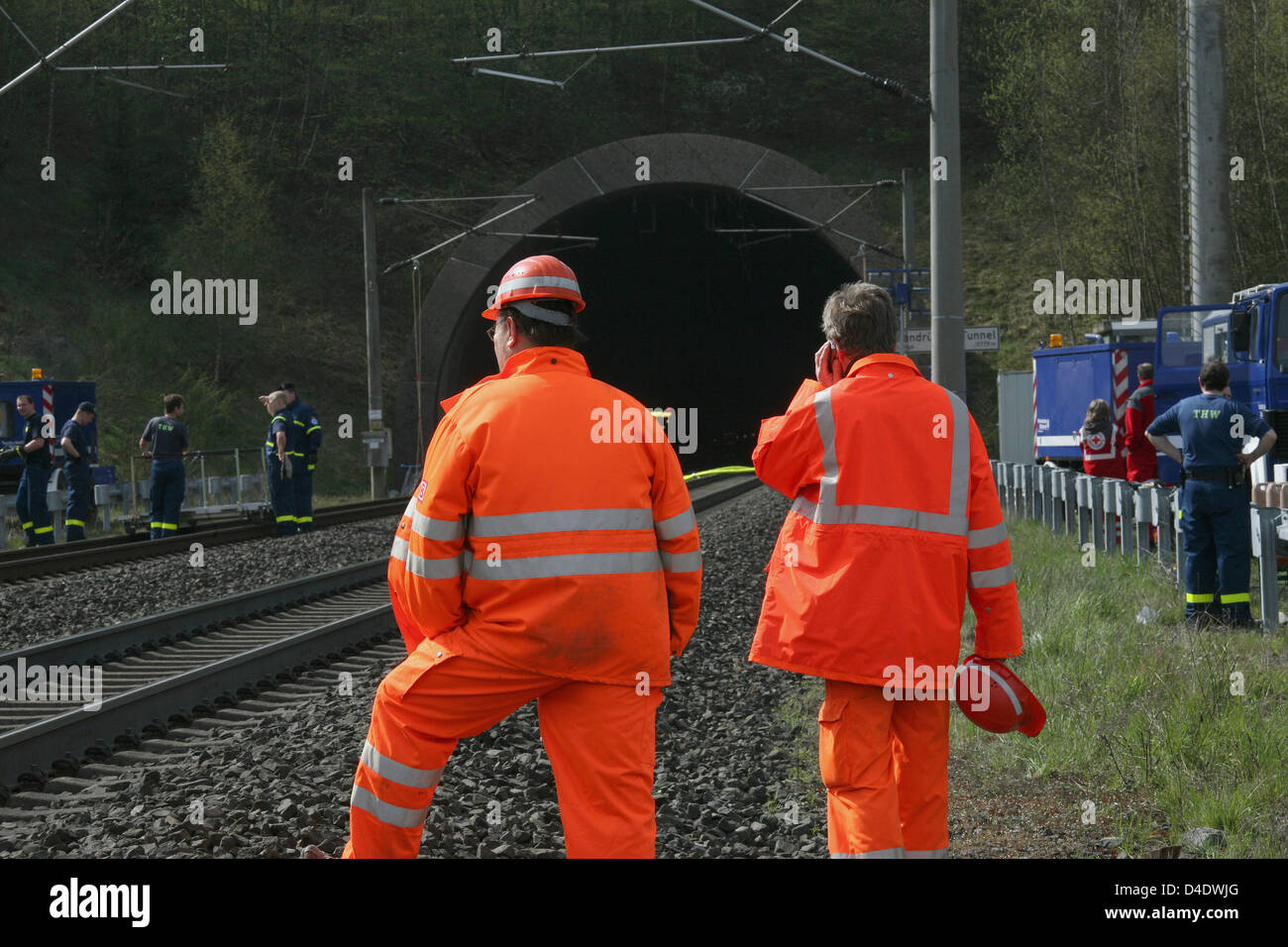 Engineers of German Railways examine the tracks in front of the ...