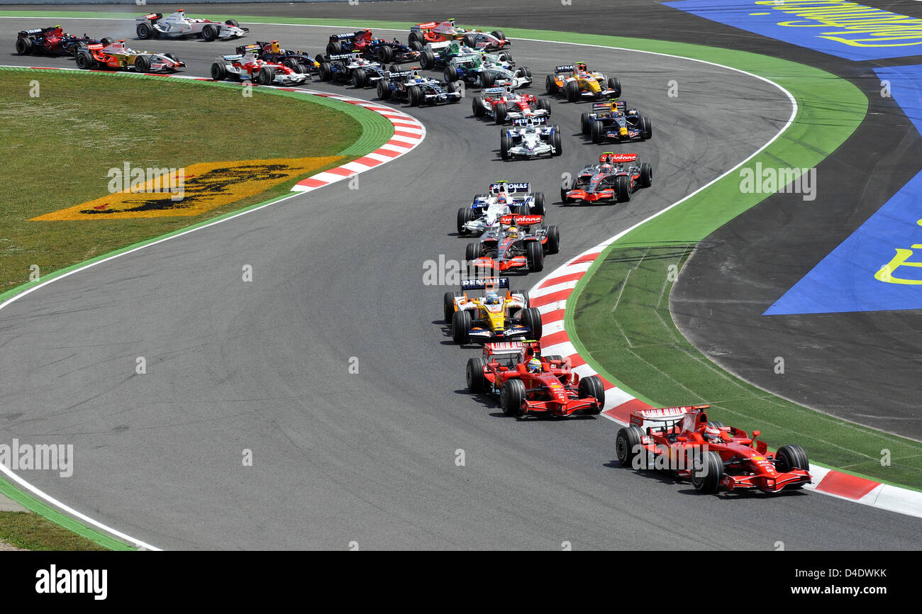 Finnish Formula One driver Kimi Raikkonen (front) of Scuderia Ferrari ...