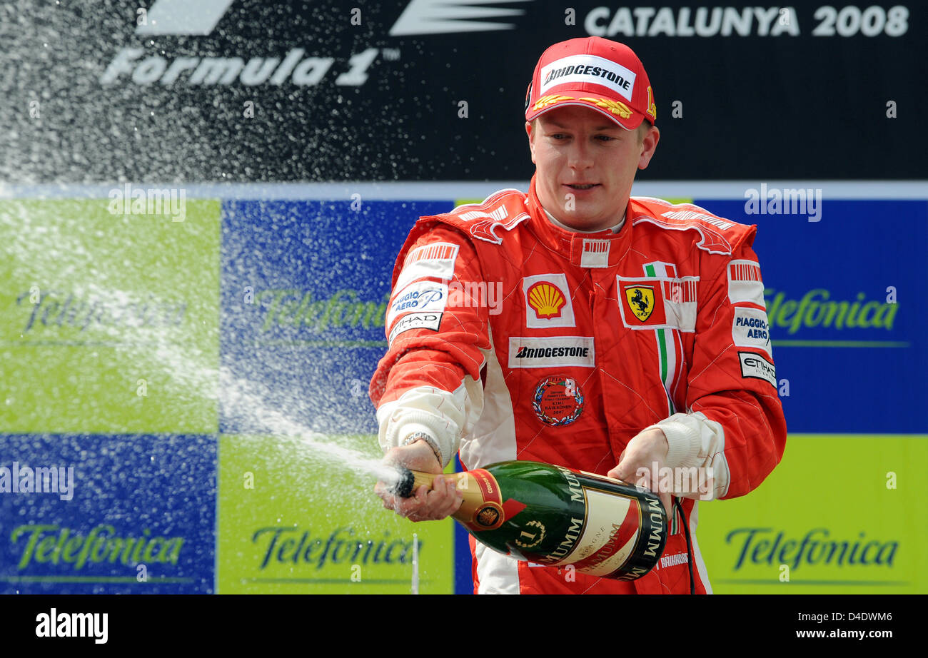 Finnish Formula One driver Kimi Raikkonen of Scuderia Ferrari sprays ...