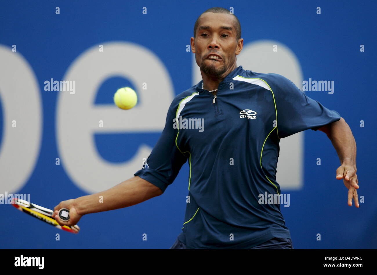 Julio Silva from Brazil plays a backhand in his first round match ...
