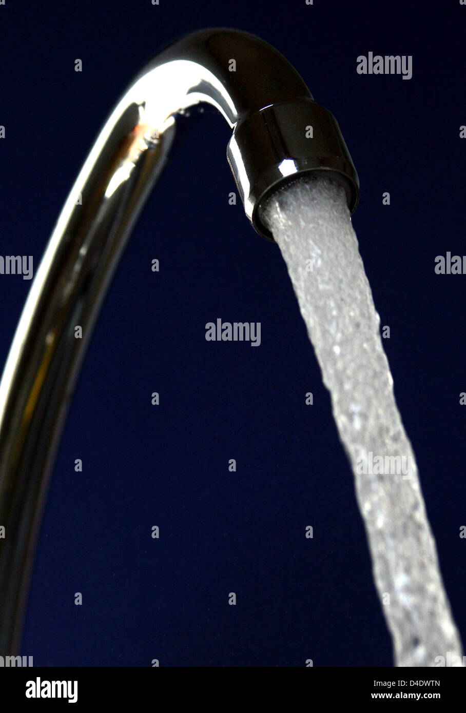 Drinking water pours out of a tap in Neukirchen, Germany, 22 April 2008 ...