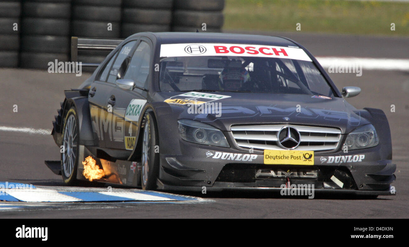 British DTM driver Paul di Resta of AMG Mercedes takes a curb at the German Touring Car Masters ...