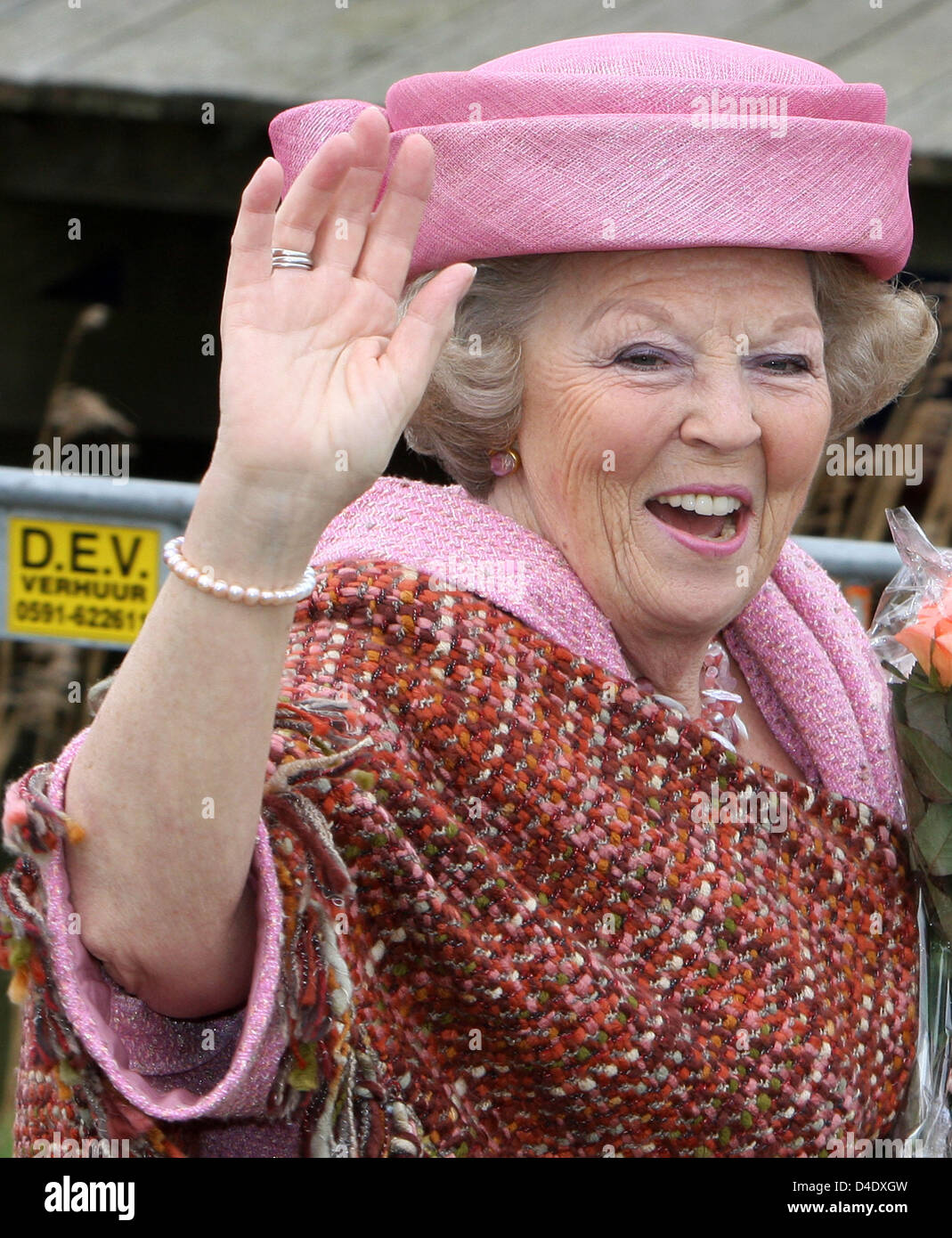Dutch Queen Beatrix waves to the crowd during the Queen's Day in ...