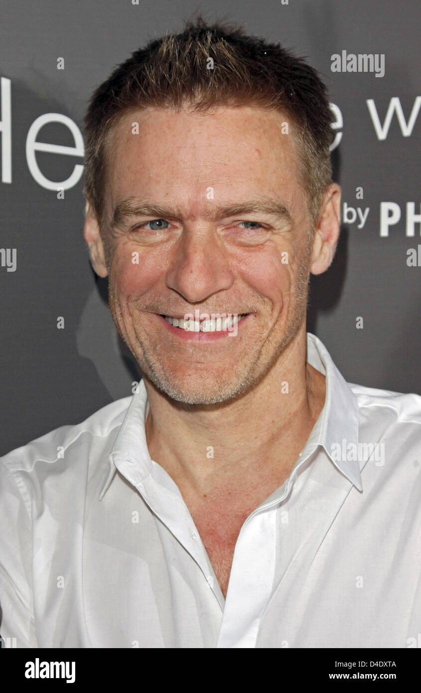 Musician and photographer Bryan Adams arrives at the opening of his ...